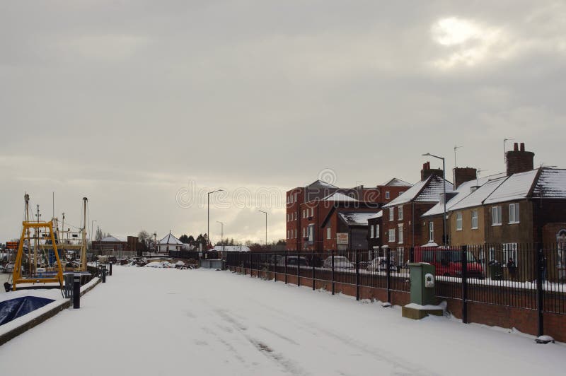 The Riverside with Fishing Boats on a Snowy Day in Winter Editorial ...