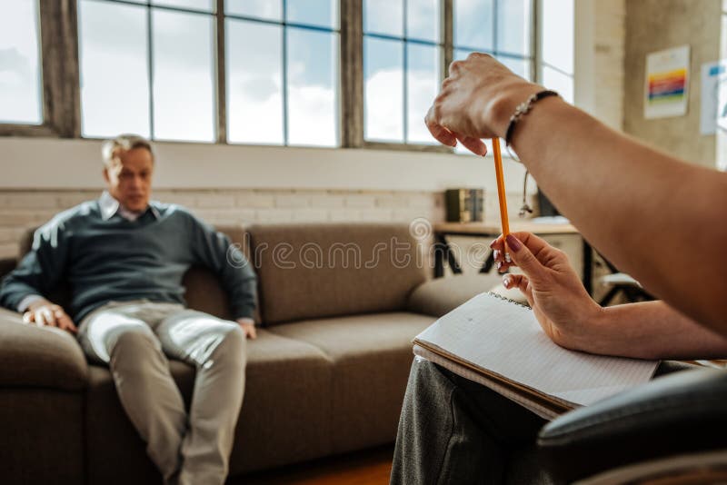 Attentive Female Psychoanalyst Writing Notes about State of Her Client ...