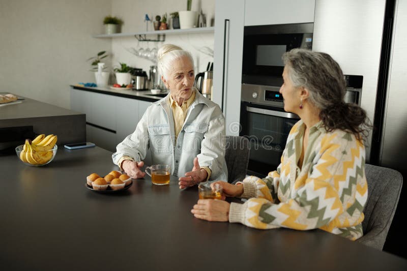 Having a Conversation in Modern Kitchen Setting Stock Image - Image of ...