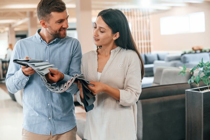 Having Fun by Choosing the Sofa. Couple is in the Store Stock Image ...