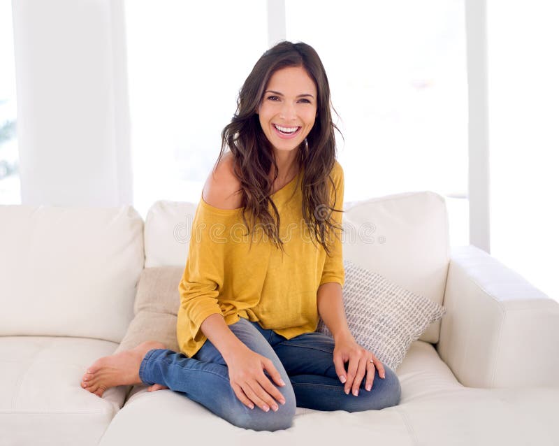 Having a Fun Day at Home. a Gorgeous Young Woman on a Couch. Stock ...