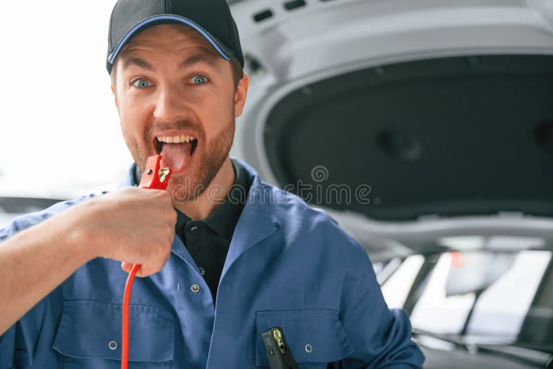 Having Fun with Electrical Terminals, Dangerous. Man in Blue Uniform is ...