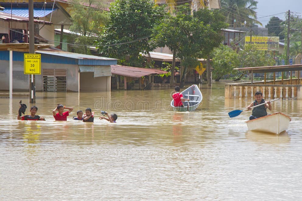 Having Fun in Flood Water editorial stock image. Image of family - 22272009