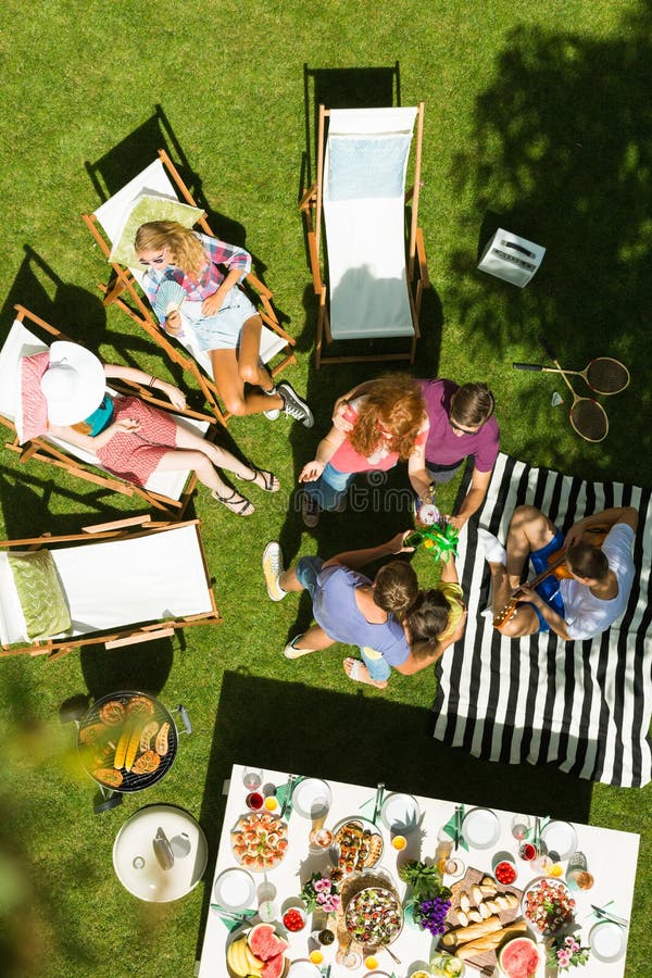 Having fun at grill party stock image. Image of garden - 96088563