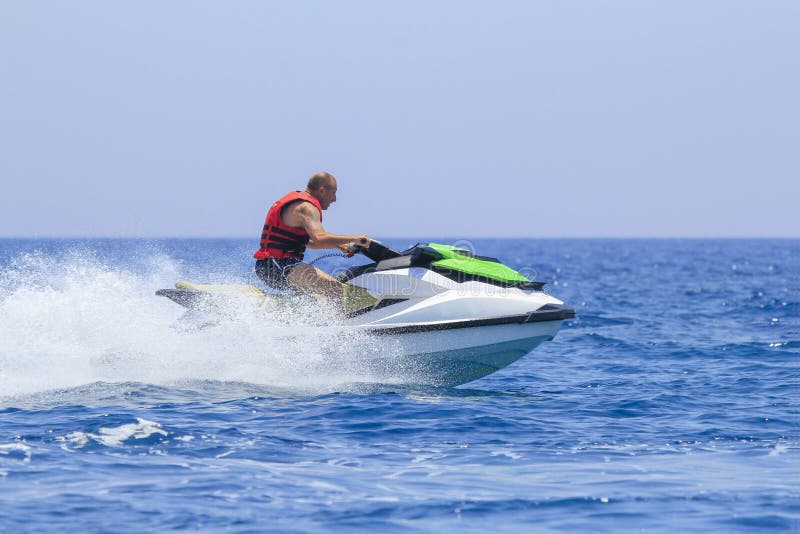 Having fun on a jet-ski stock image. Image of action - 83628919