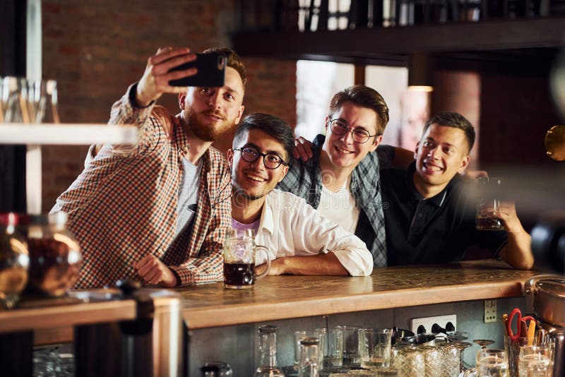 Having Fun. People in Casual Clothes Sitting in the Pub Stock Image ...