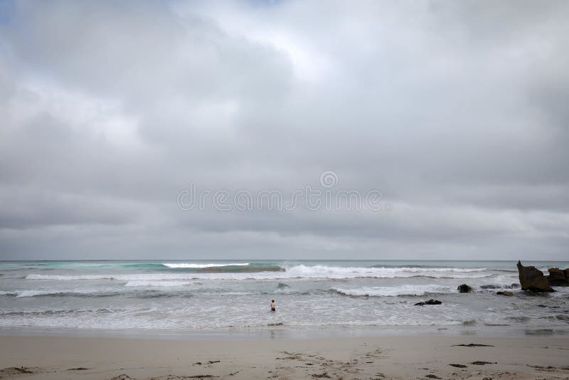 Having Fun on the Sandy Beach with Rocky Cliffs Stock Photo - Image of ...