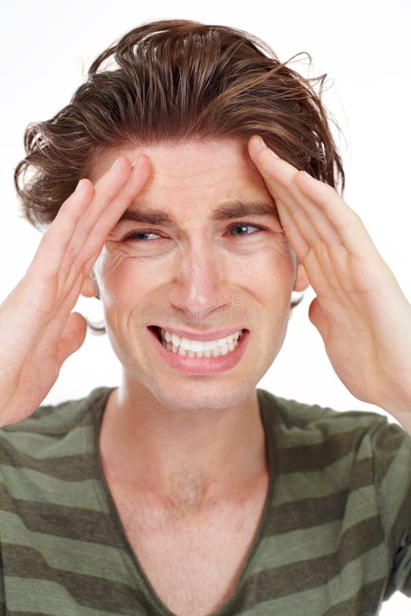 Having One of those Days...Young Man Holding His Forehead with an ...