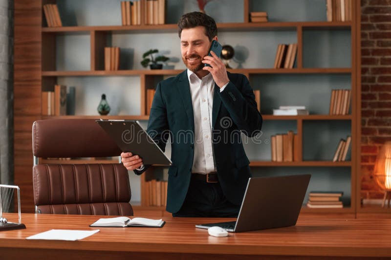 Having Phone Call. Businessman in Formal Clothes is Working Indoors ...