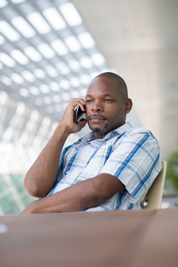 Having phone call stock image. Image of serious, calling - 60572903