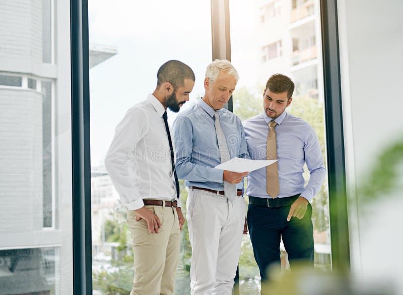 Having a Quick Meeting in the Office. a Group of Colleagues Having a ...