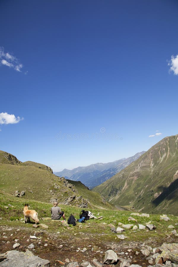 Having a Rest on a Hiking Tour Stock Image - Image of guide, luggage ...