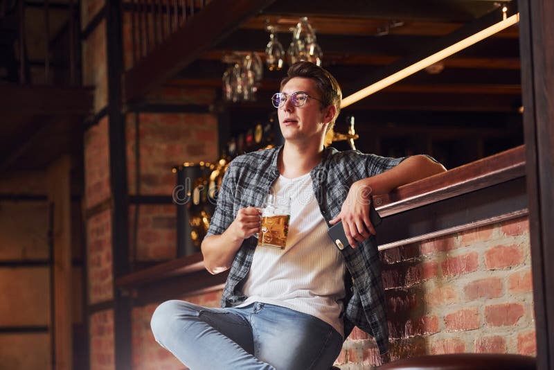Having a Rest. Man in Casual Clothes Sitting in the Pub Stock Photo ...