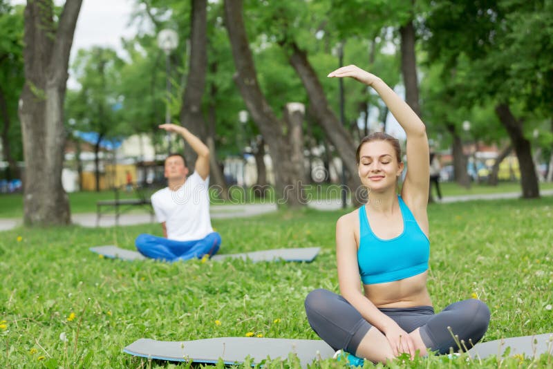 Having Yoga Practice in Park Stock Image - Image of sitting, male: 71219247