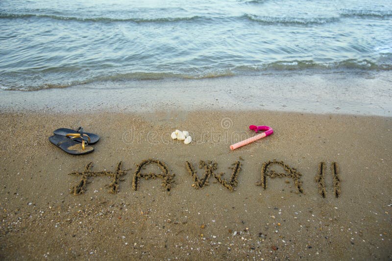 Hawaii Written on the Sand with Snorkel an Beach Sleepers. Stock Photo ...
