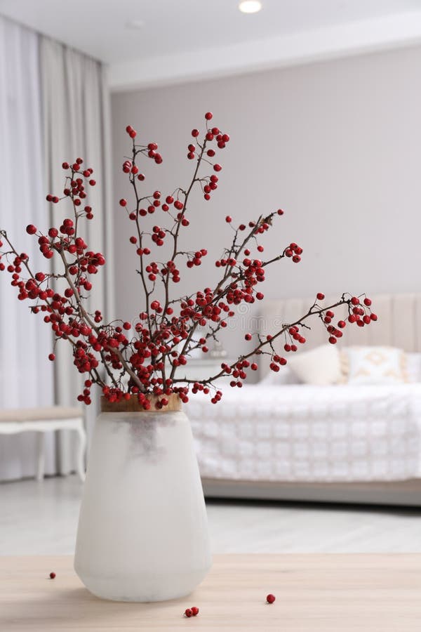 Hawthorn Branches with Red Berries on Wooden Table in Bedroom Stock ...