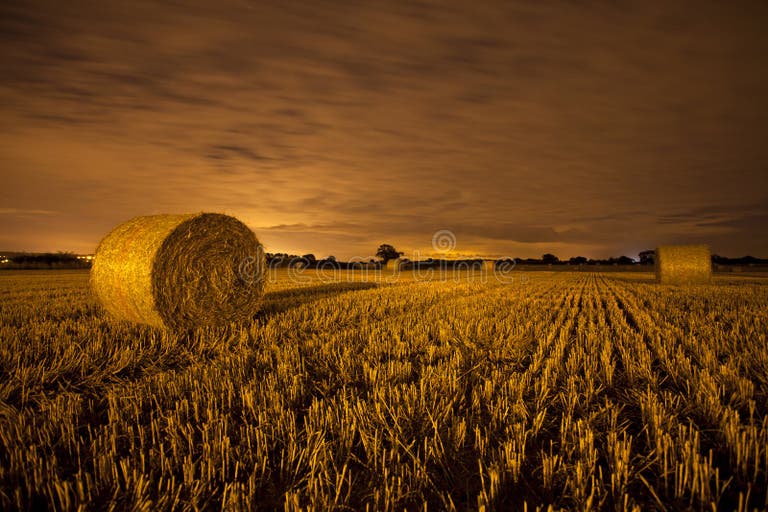 Hay bails at night stock image. Image of farming, traditional - 23972815
