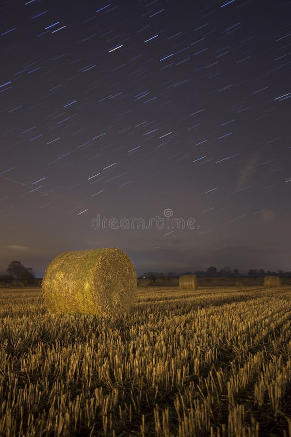Hay bails at night stock image. Image of light, farmland - 30005319