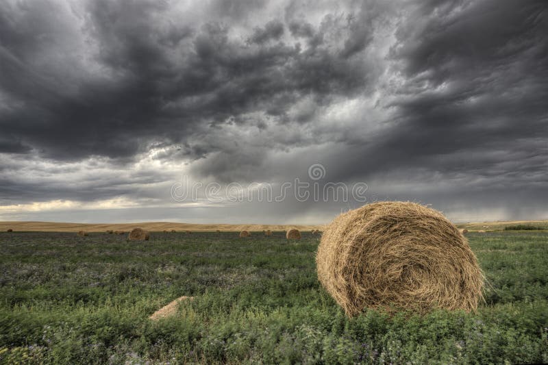 Hay Bale and Prairie Storm stock image. Image of country - 21326941
