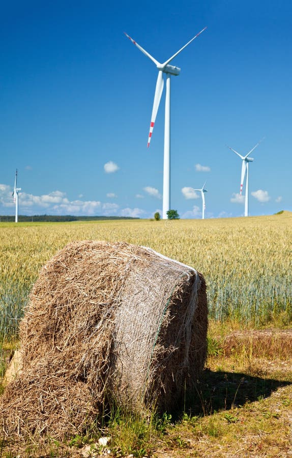 Hay Bale with Wind Turbines Stock Photo - Image of seasonal, plant ...