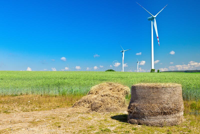 Hay Bale with Wind Turbines Stock Photo - Image of seasonal, cereal ...