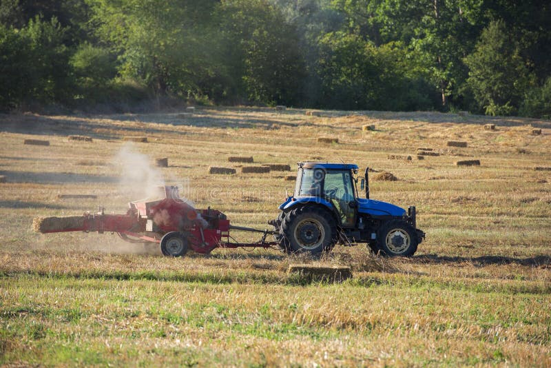 Hay baler in the field stock photo. Image of natural - 131233406