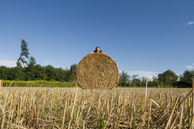 Hay bales Man stock image. Image of lying, caucasian - 25856321