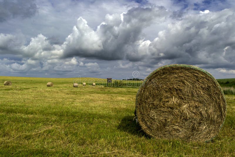 Hay Pack after Harvest in the Meadow and Storm Clouds Stock Photo ...