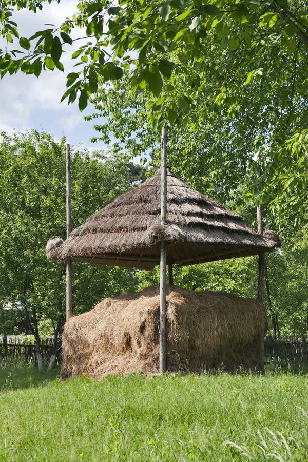 Hay stack with the roof stock photo. Image of nature - 25244708