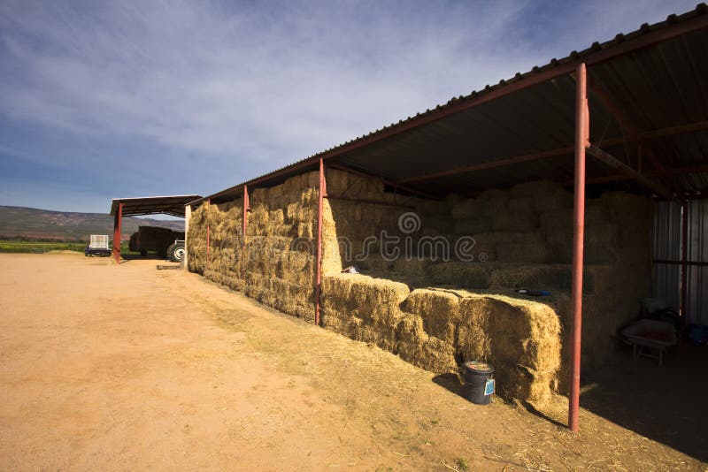 Hay storage shed on a farm stock image. Image of straw - 26031219