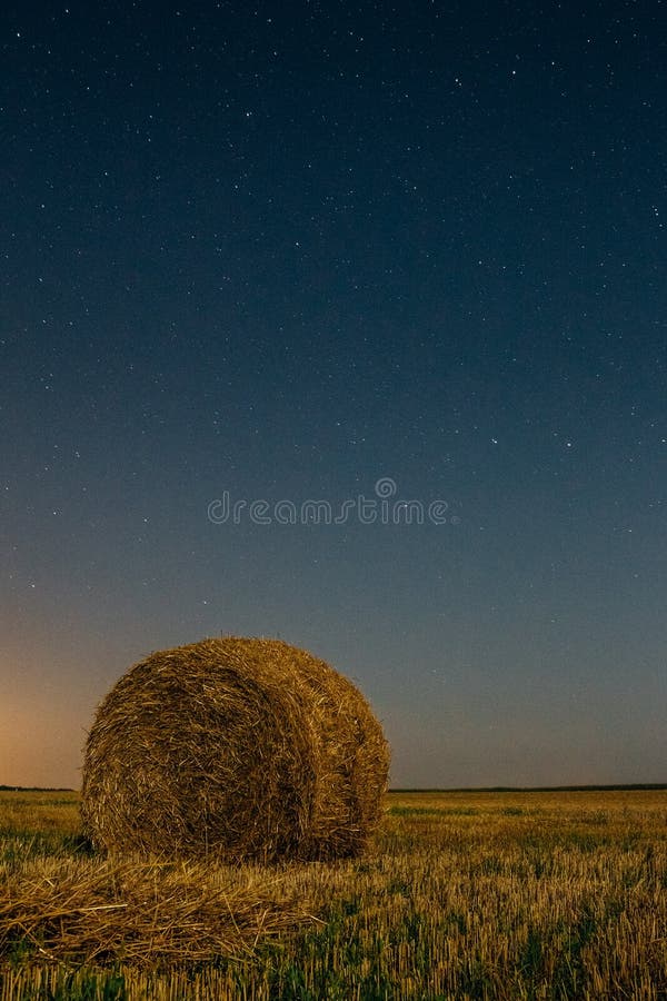 A Haystack in a Field Under a Starry Sky Stock Photo - Image of round ...