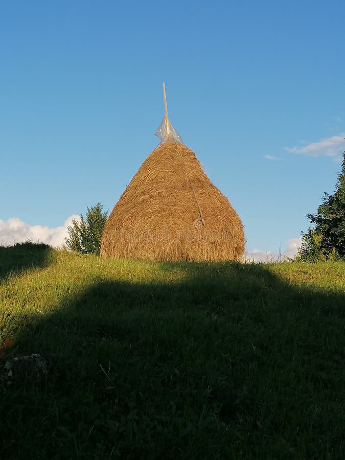 Haystack on the hill stock photo. Image of mountain - 190594334