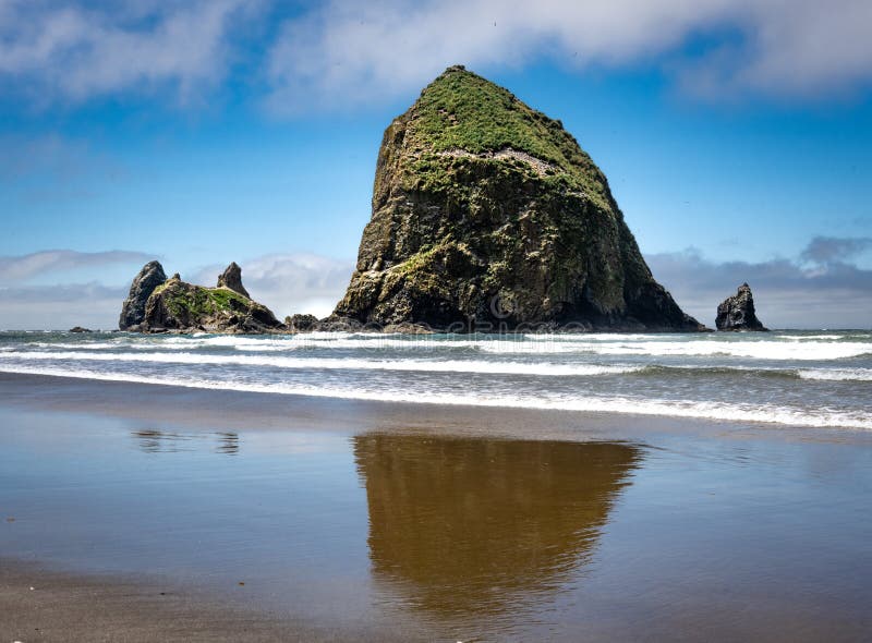 Haystack Rock at Cannon Beach in Oregon Stock Image - Image of blue ...