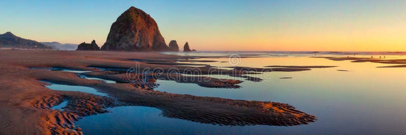 Haystack Rock at Cannon Beach, Oregon at Sunset Stock Photo - Image of ...