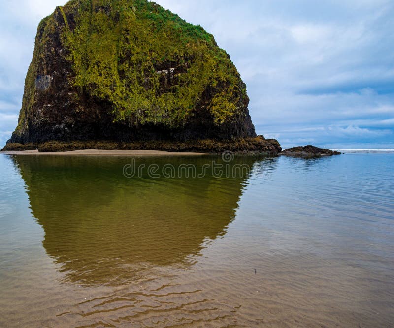 Haystack Rock in the Cannon Beach in Oregon, USA Stock Photo - Image of ...