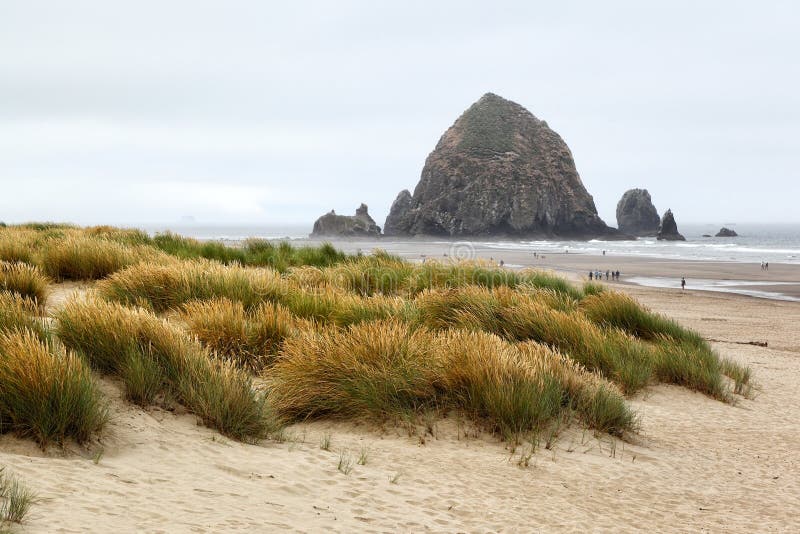 Haystack Rock at Cannon Beach, Oregon Stock Photo - Image of tourist ...