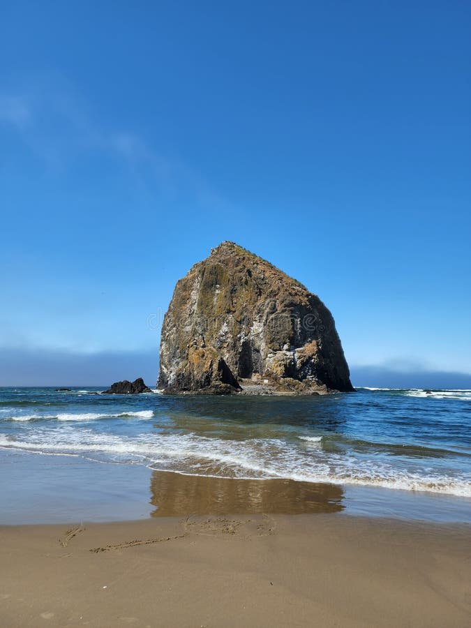 Haystack Rock on Cannon Beach in Summer Blue Sky Stock Image - Image of ...
