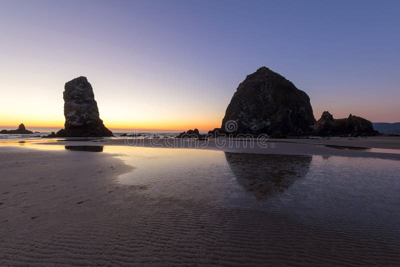 Haystack Rock at Cannon Beach after Sunset Stock Photo - Image of ...
