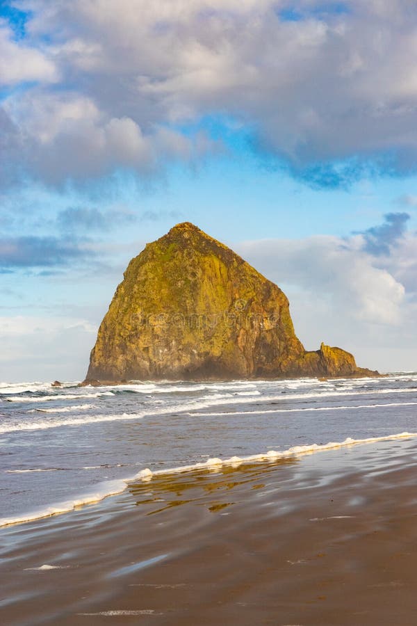 Haystack Rock in the Morning Sun Stock Photo - Image of sand, pacific ...