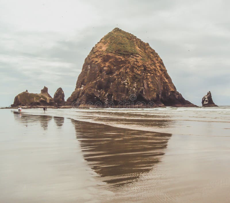 Haystack Rock on the Oregon Coast Stock Photo - Image of cloudy, ocean ...