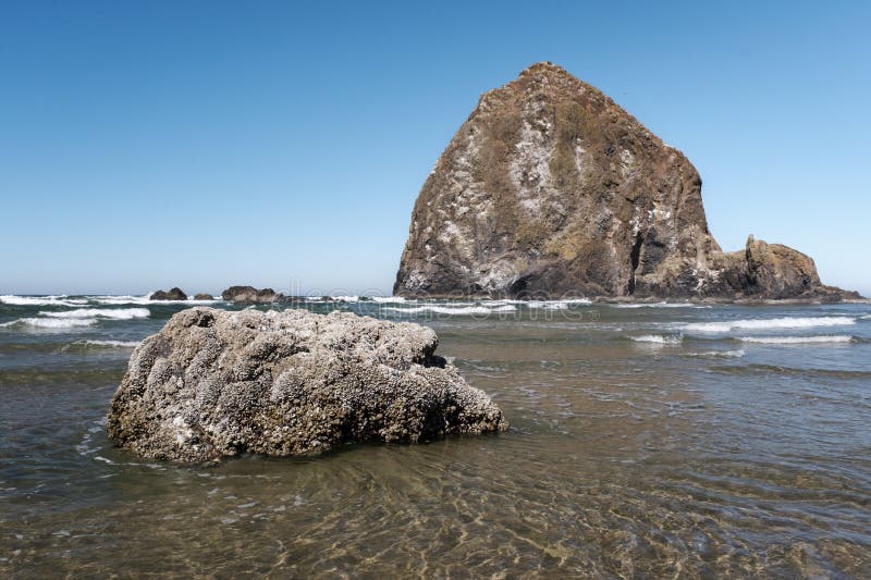 Haystack Rock and Other Formations at Cannon Beach, Oregon Stock Image ...