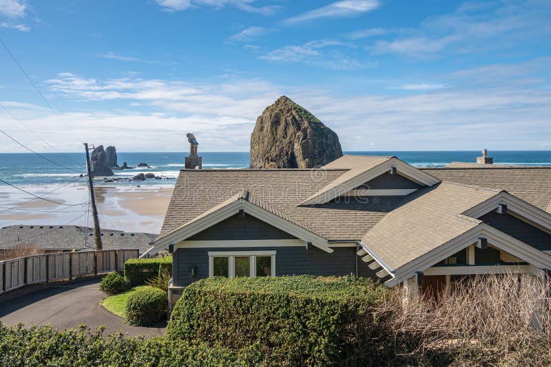 Haystack Rock in Canon Beach Oregon Stock Photo - Image of people ...
