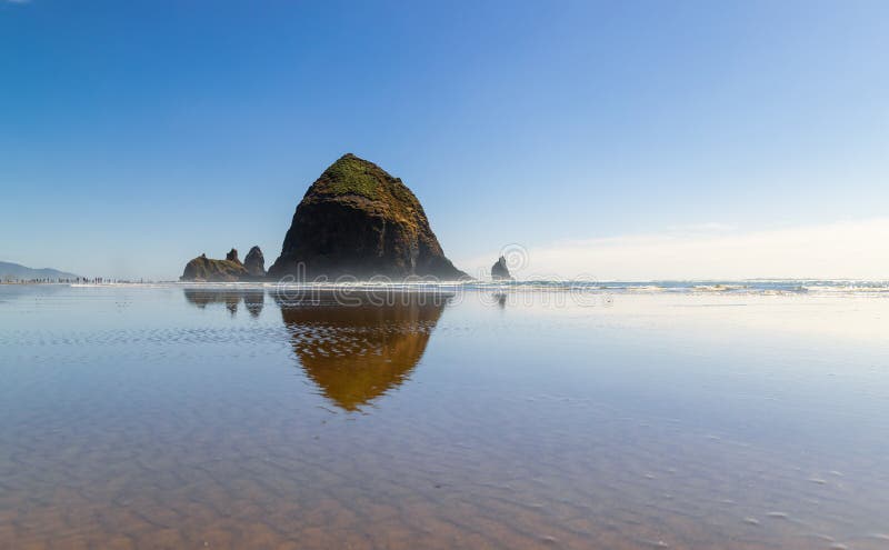 Haystack Rock and Wet Beach at Pacific Coast in Oregon State Stock ...