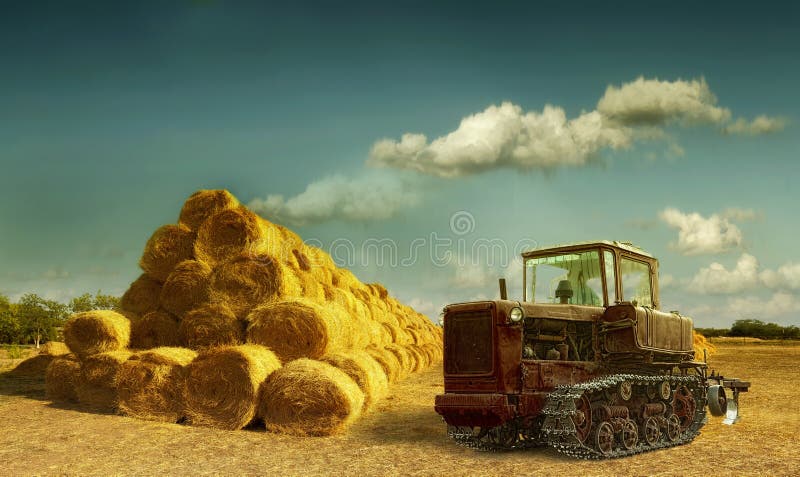 Haystacks on the Field. Old Tractor and Hay Stack Stock Photo - Image ...