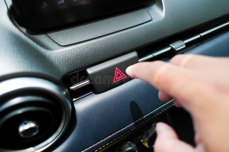 The Hazard or Emergency Light Button is Pressed by the Driver Hand ...