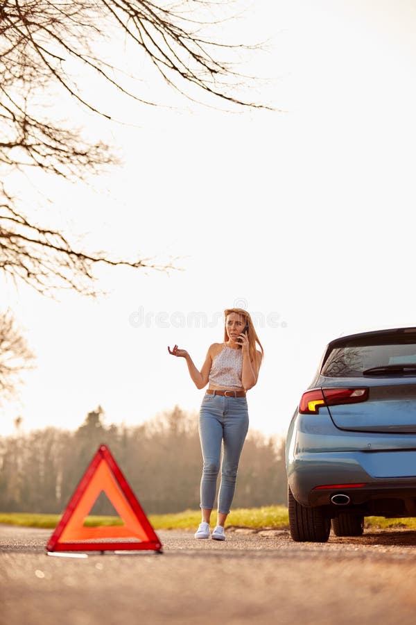 Hazard Warning Triangle Sign for Car Breakdown on Road with Woman ...