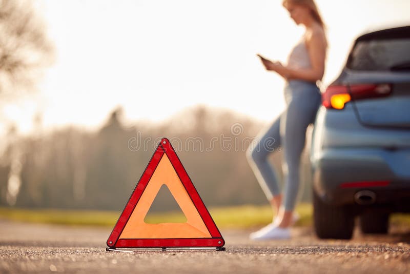 Hazard Warning Triangle Sign for Car Breakdown on Road with Woman ...