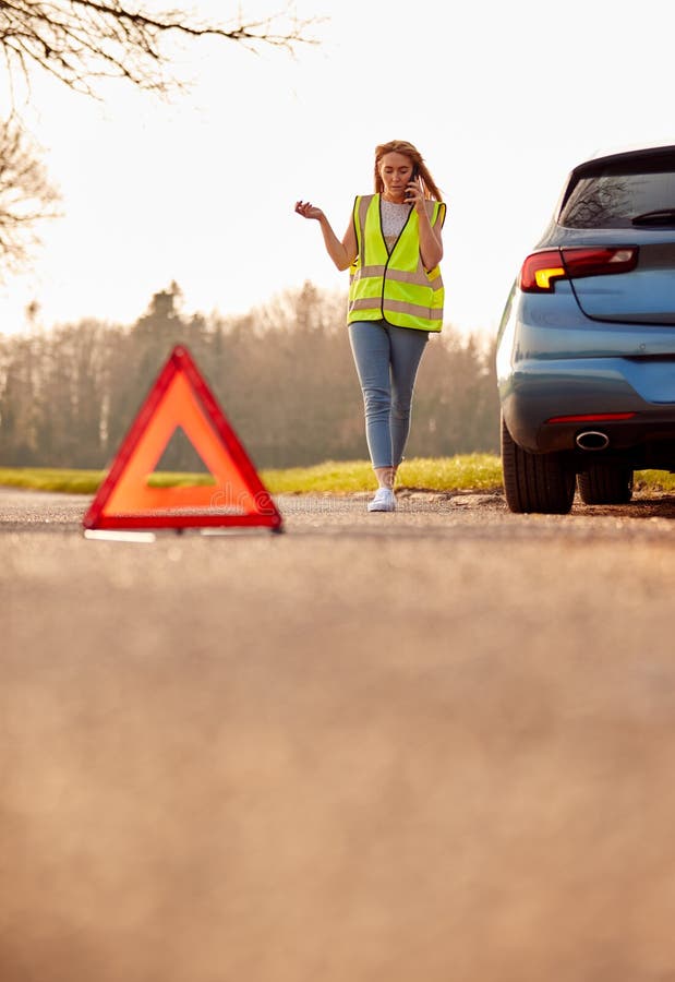 Hazard Warning Triangle Sign for Car Breakdown on Road with Woman ...