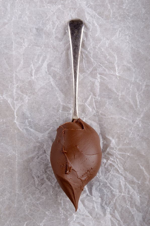 Hazelnut cream on a spoon stock photo. Image of dark - 46091068