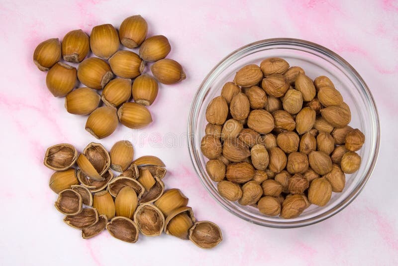 Hazelnut Kernels in a Bowl and Nuts Together with Empty Shells on a ...